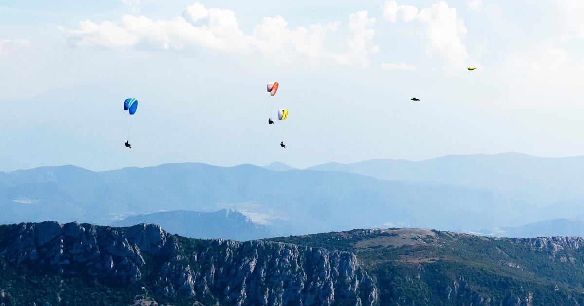 Wingsuits and paragliders descend on French castle