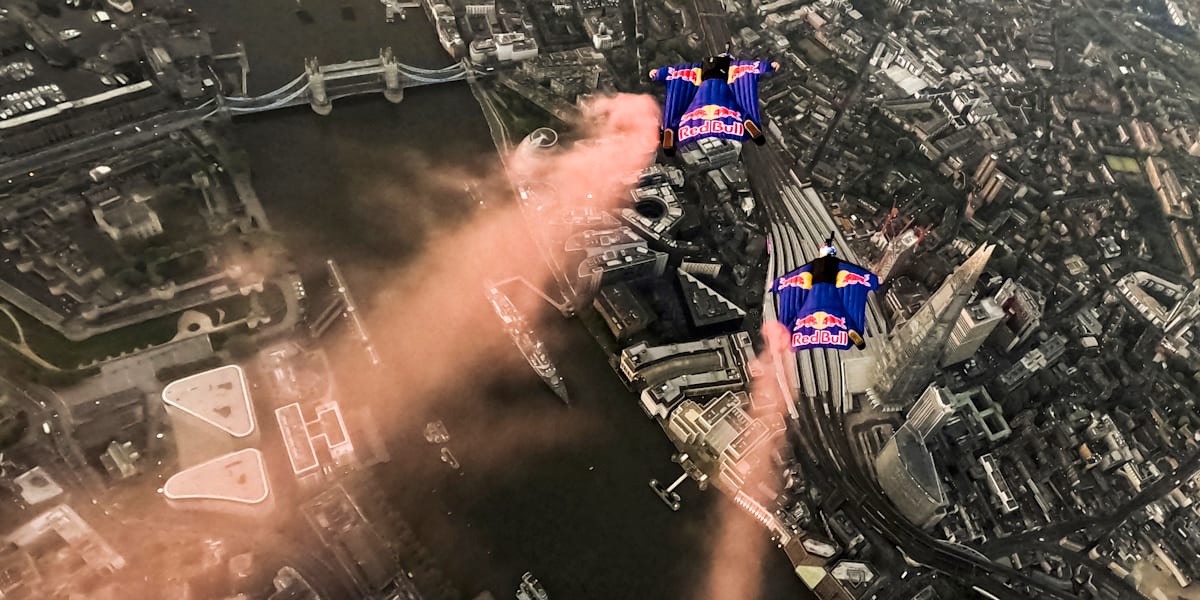 Wingsuit fliers soar through Tower Bridge at 250kph