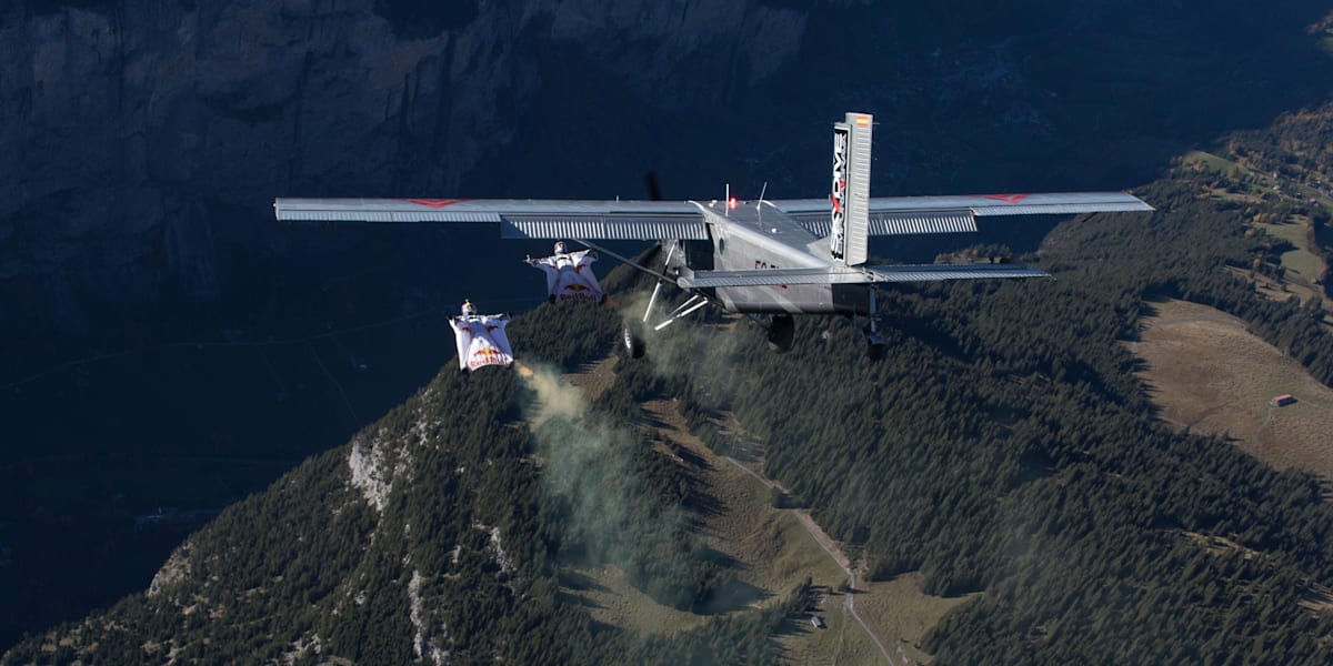 Wingsuit Pilots BASE Jump Into Flying Plane Video