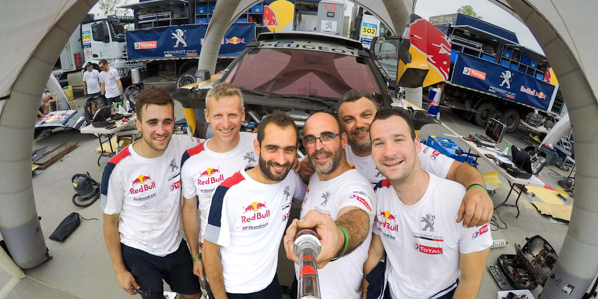Silk Way Rally: Peugeot mechanic crew work rally car