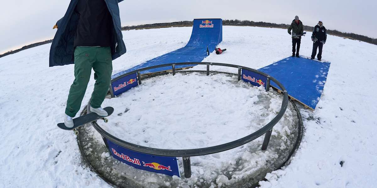 Winter skateboarding with a twist on a frozen lake
