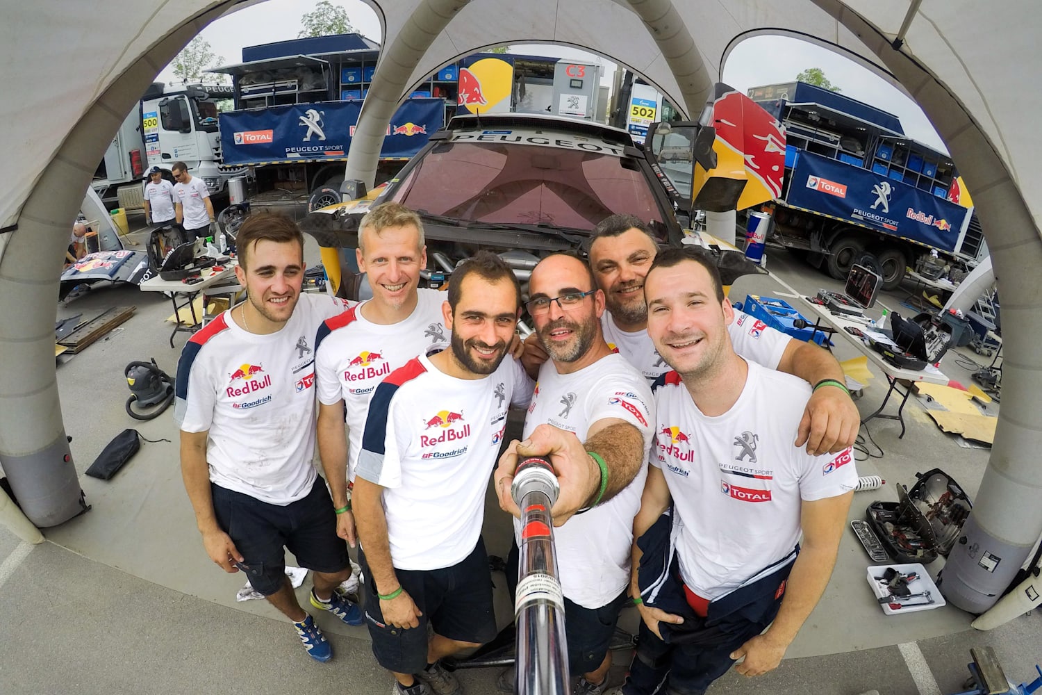 Silk Way Rally: Peugeot mechanic crew work rally car