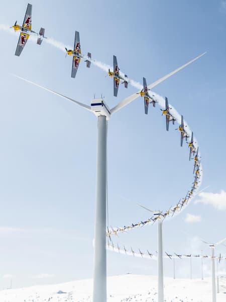 Red Bull Air Race champion slaloms through a wind farm