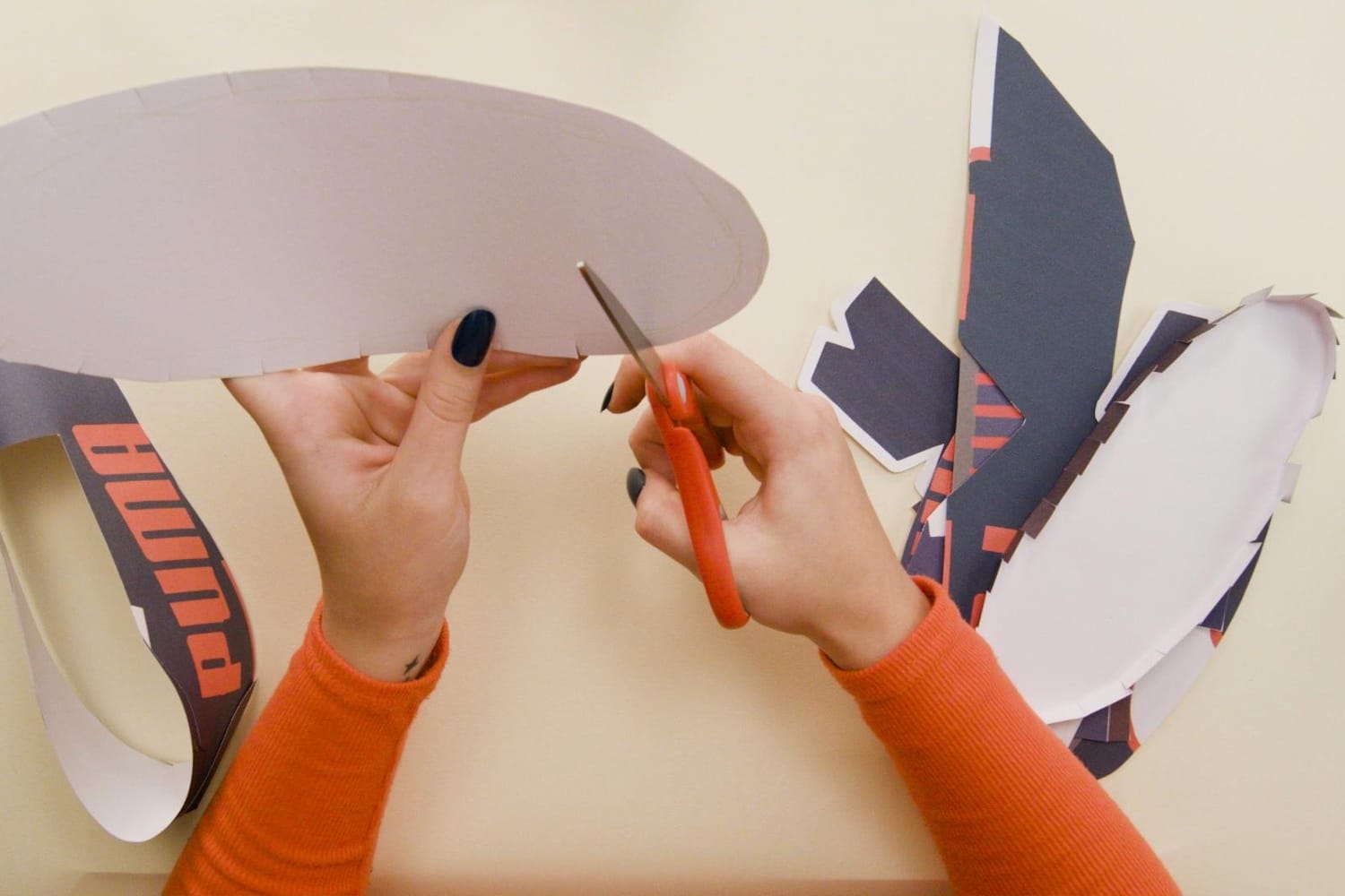 Builds a cardboard replica of Daniel Ricciardo's shoe