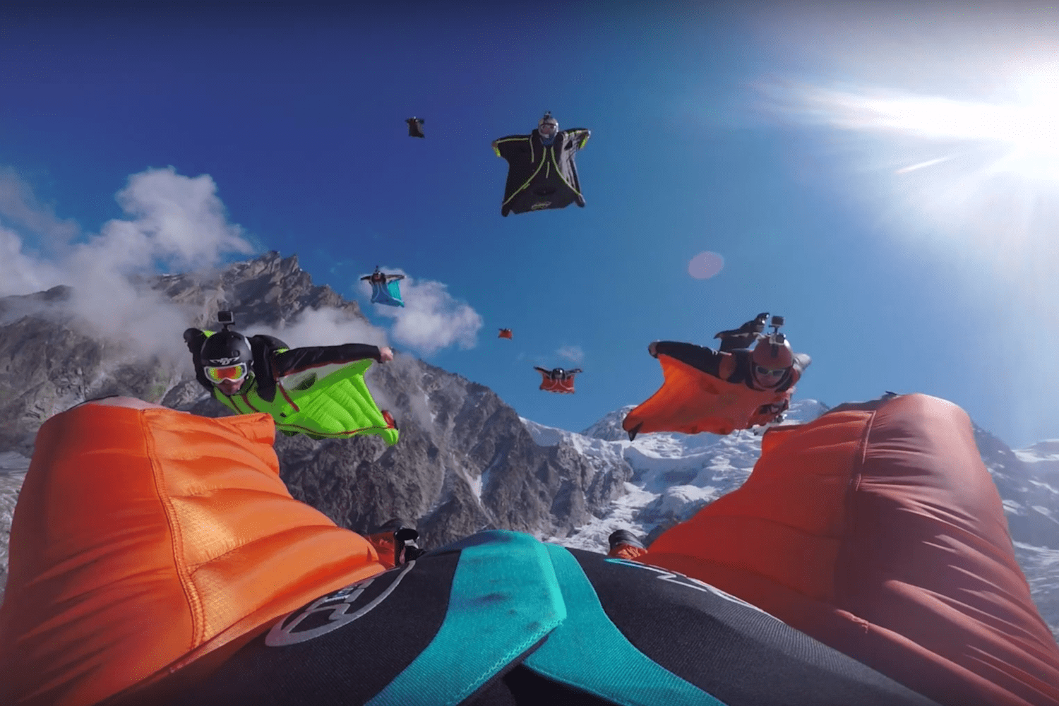Watch video of a 12-person wingsuit flight in Chamonix