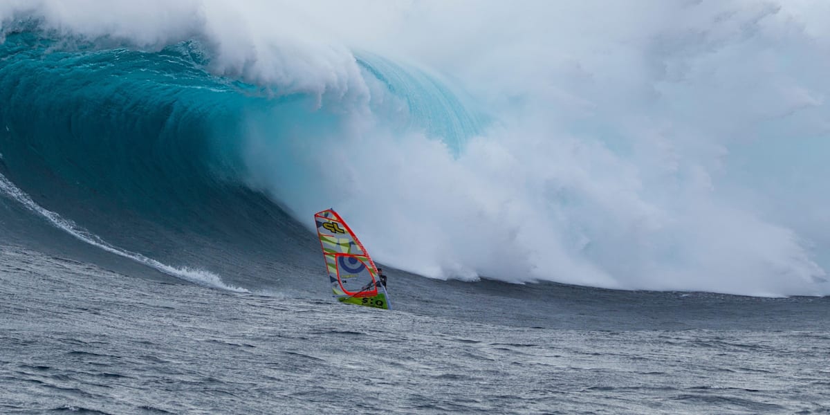 Alastair McLeoad windsufer taking on a monster wave
