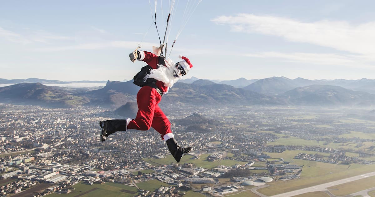 Watch Santa deliver some gifts while skydiving Red Bull