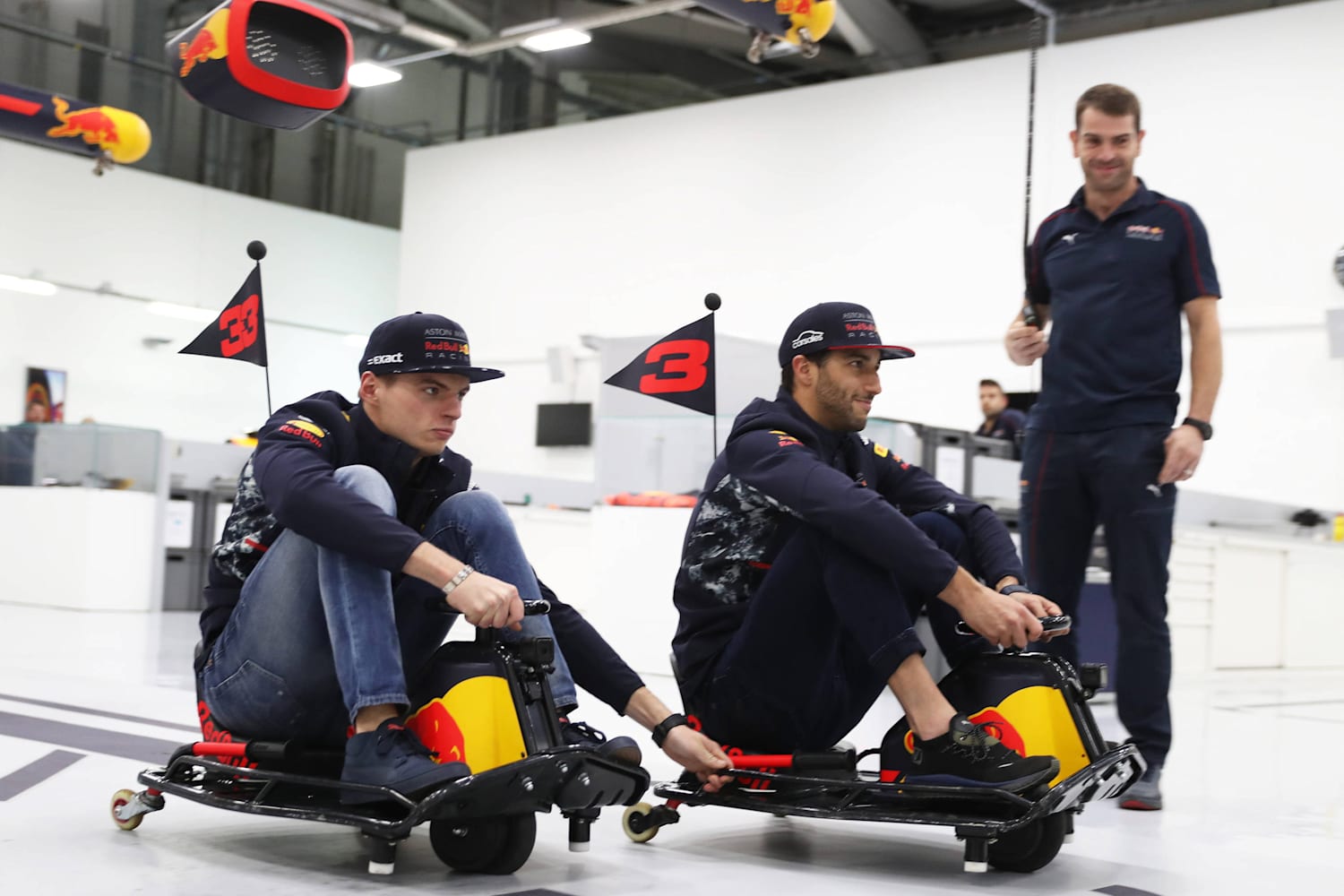 Max Verstappen and Daniel Ricciardo cart race in office