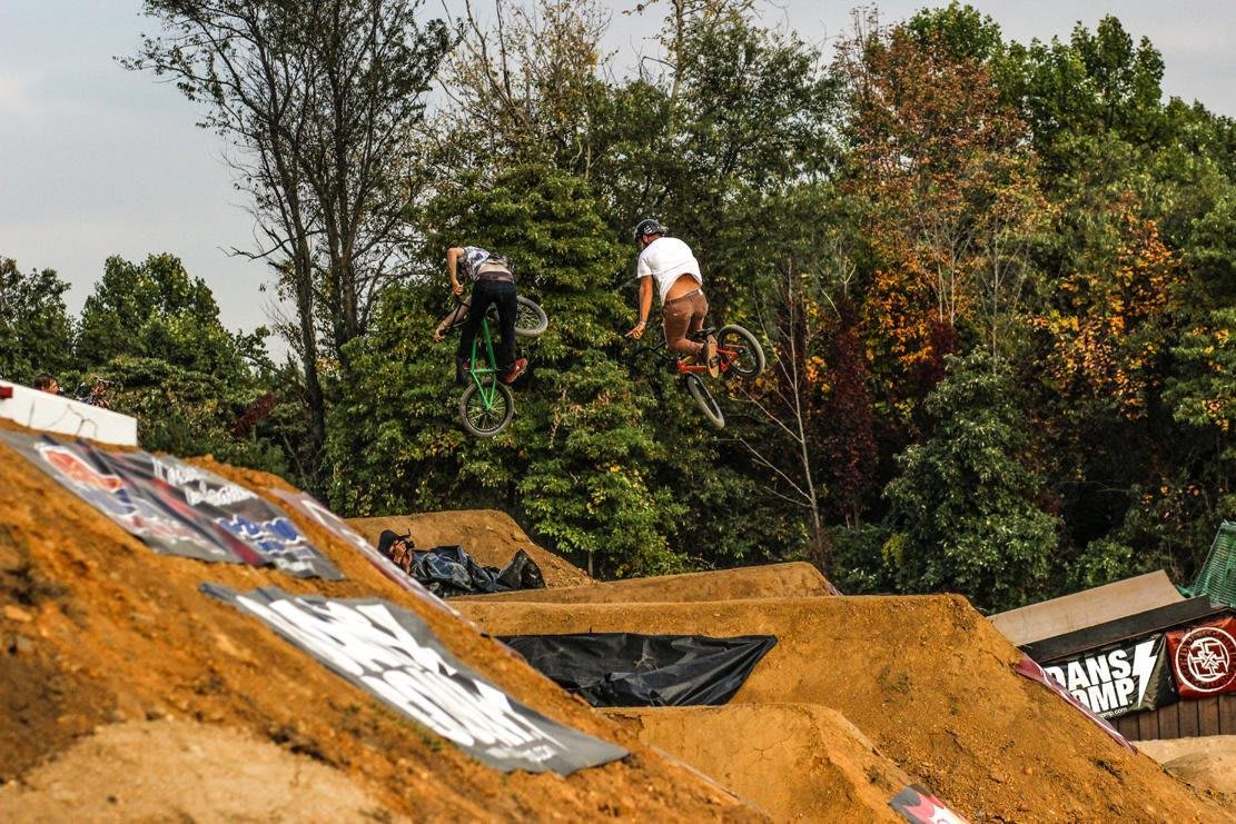 Double Cross: Two Riders Race Thru BMX Dirt Jumps